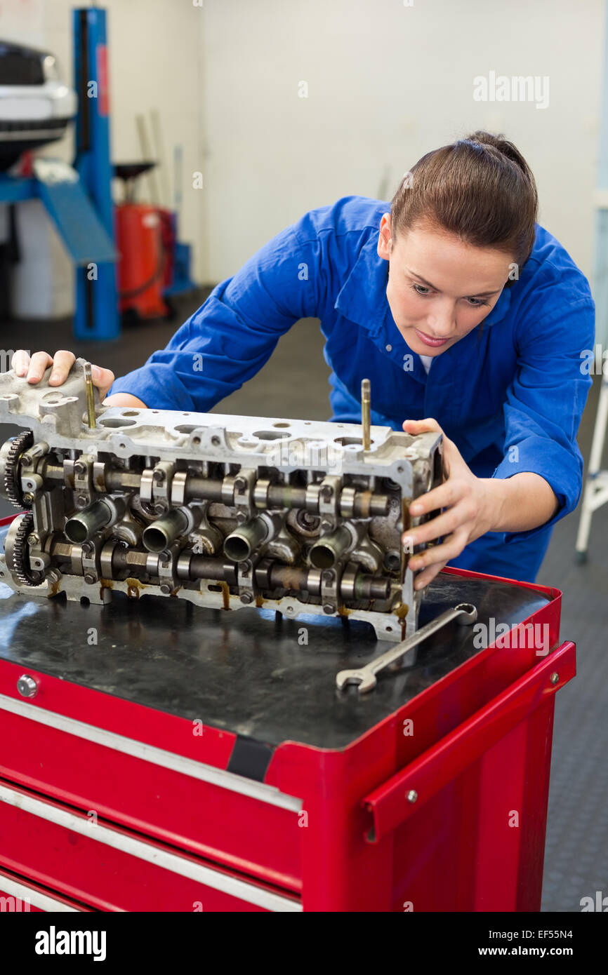 Mechanic working on an engine Stock Photo - Alamy