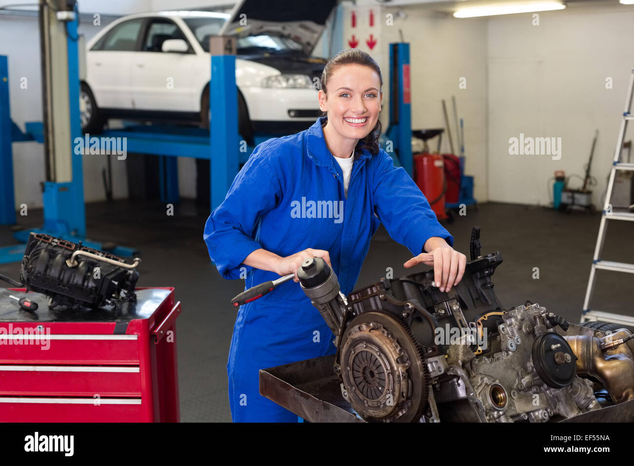 Mechanic working on an engine Stock Photo - Alamy