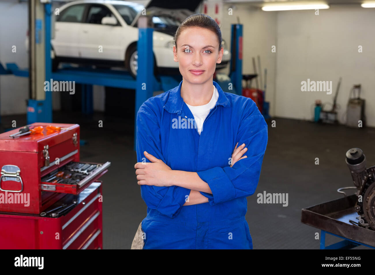 Mechanic smiling at the camera Stock Photo - Alamy