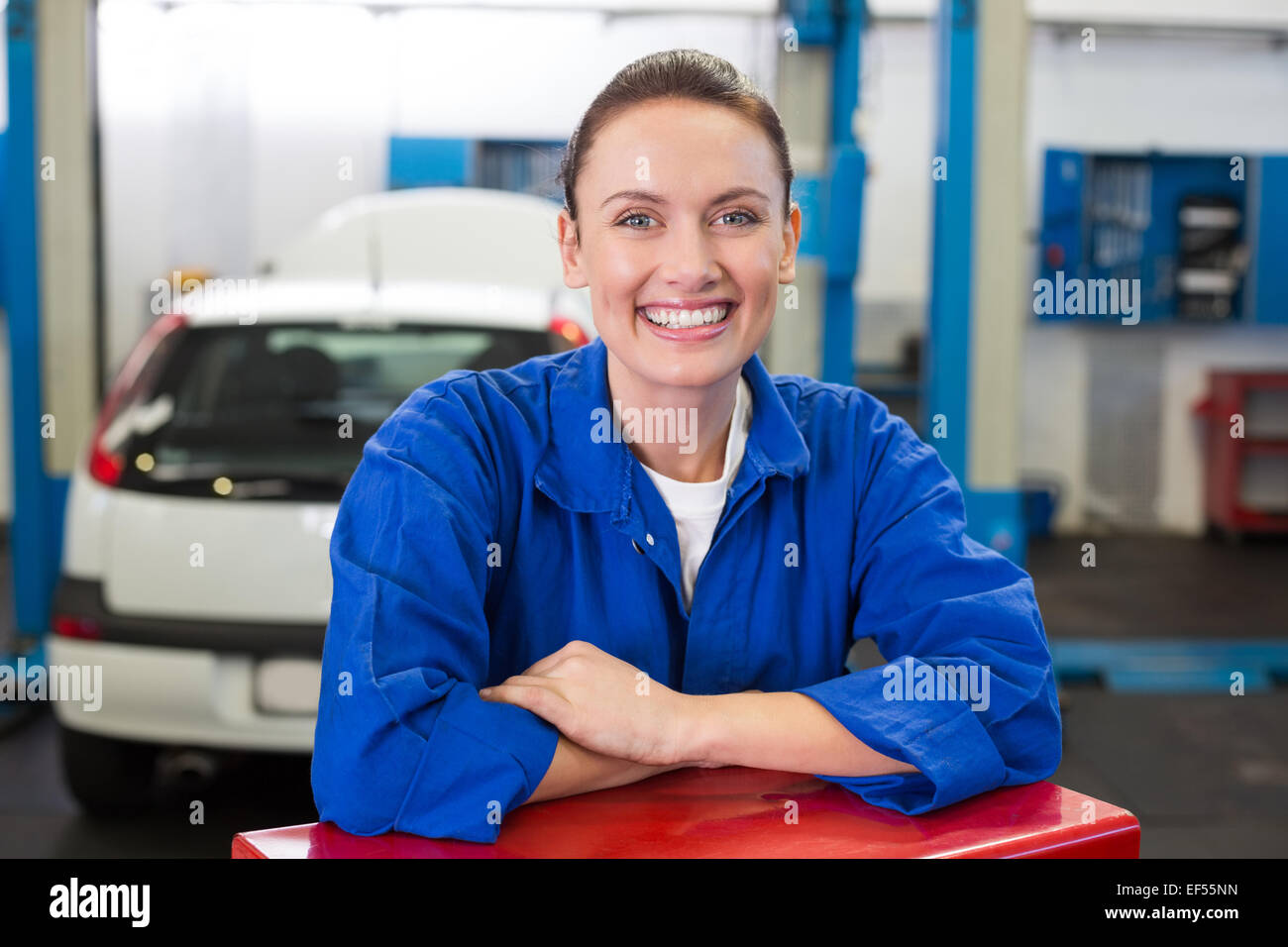 Mechanic smiling at the camera Stock Photo - Alamy