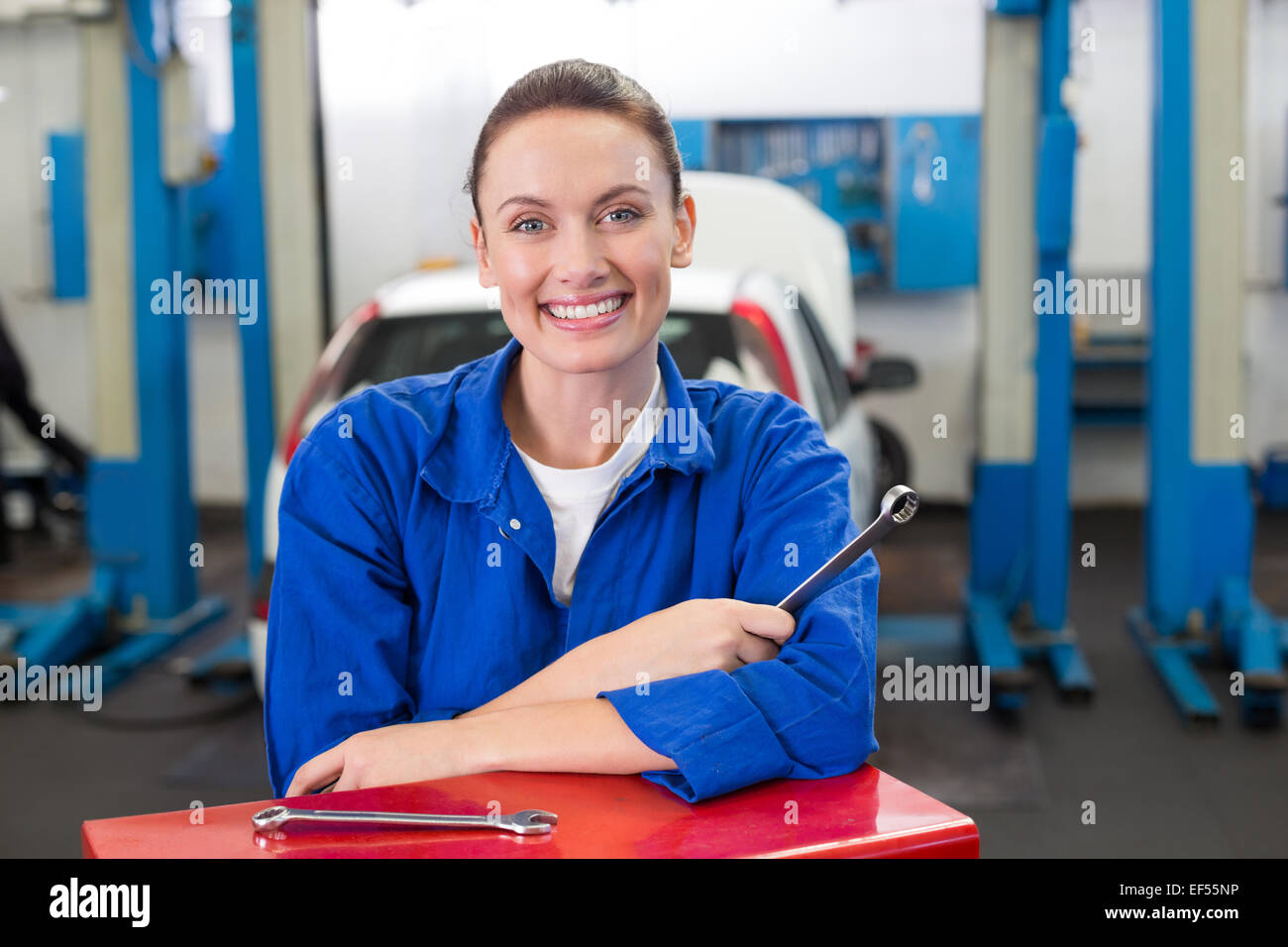 Mechanic smiling at the camera Stock Photo - Alamy