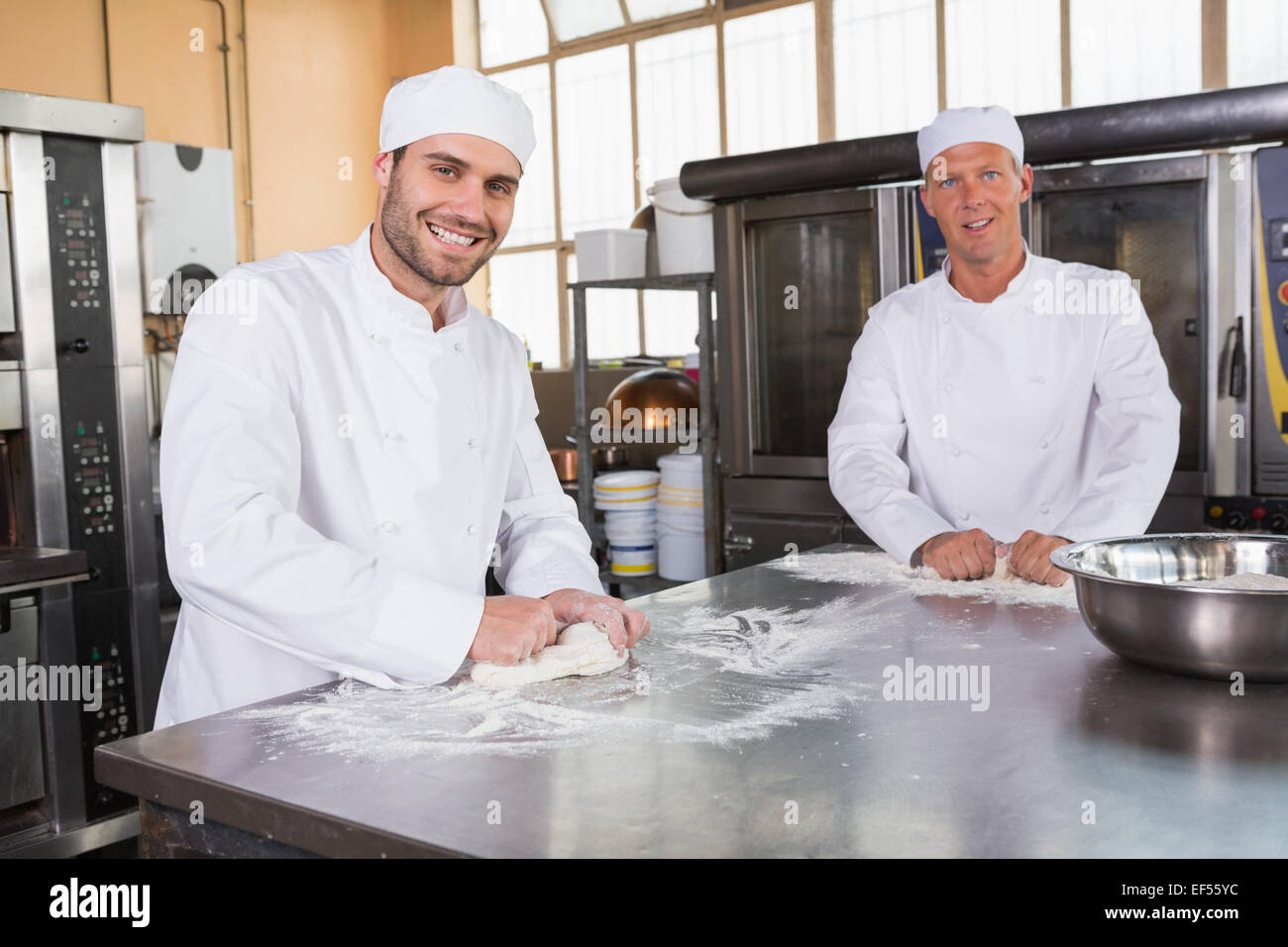 Team of bakers working together Stock Photo - Alamy