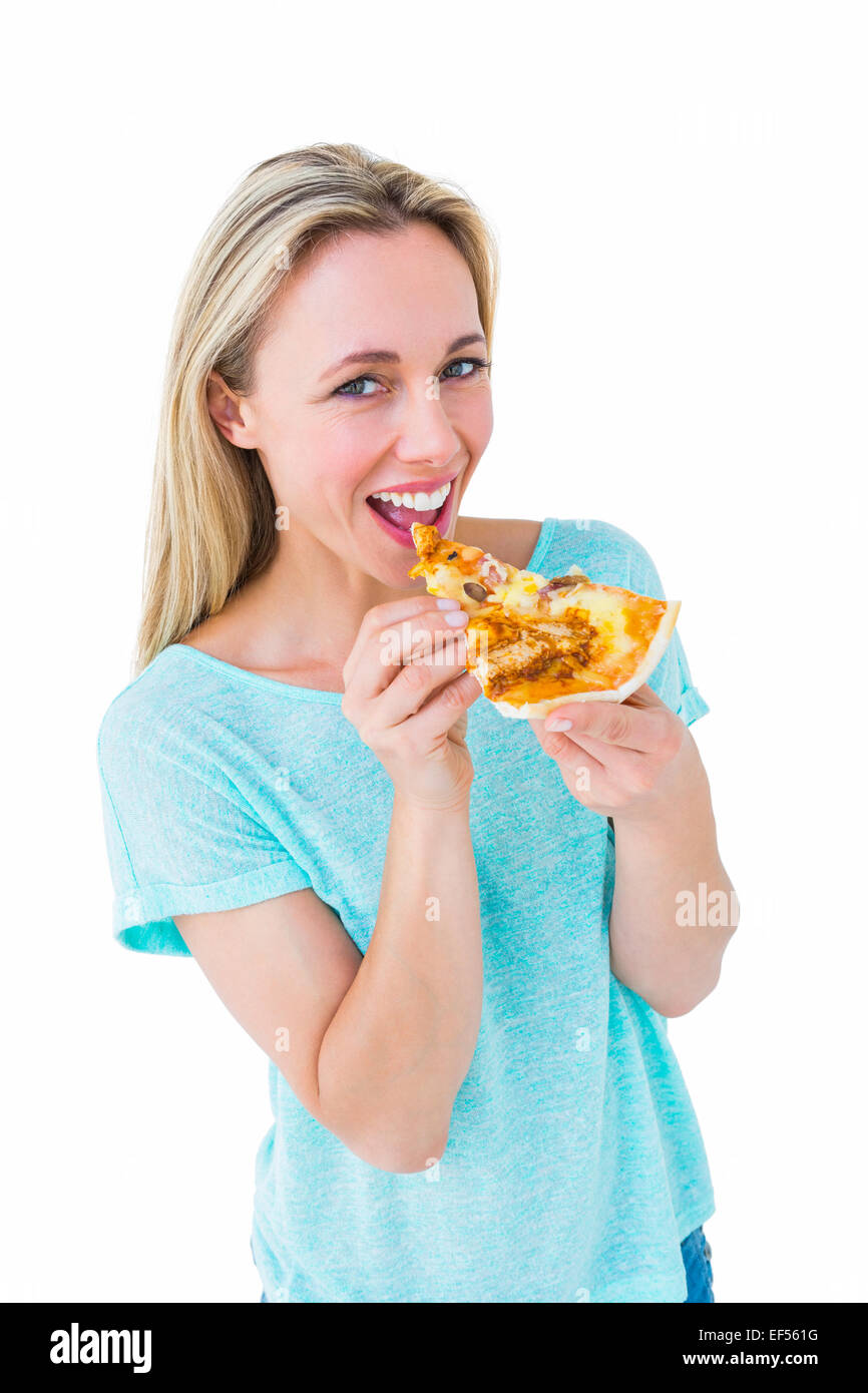 Cheerful blonde eating slice of pizza Stock Photo - Alamy