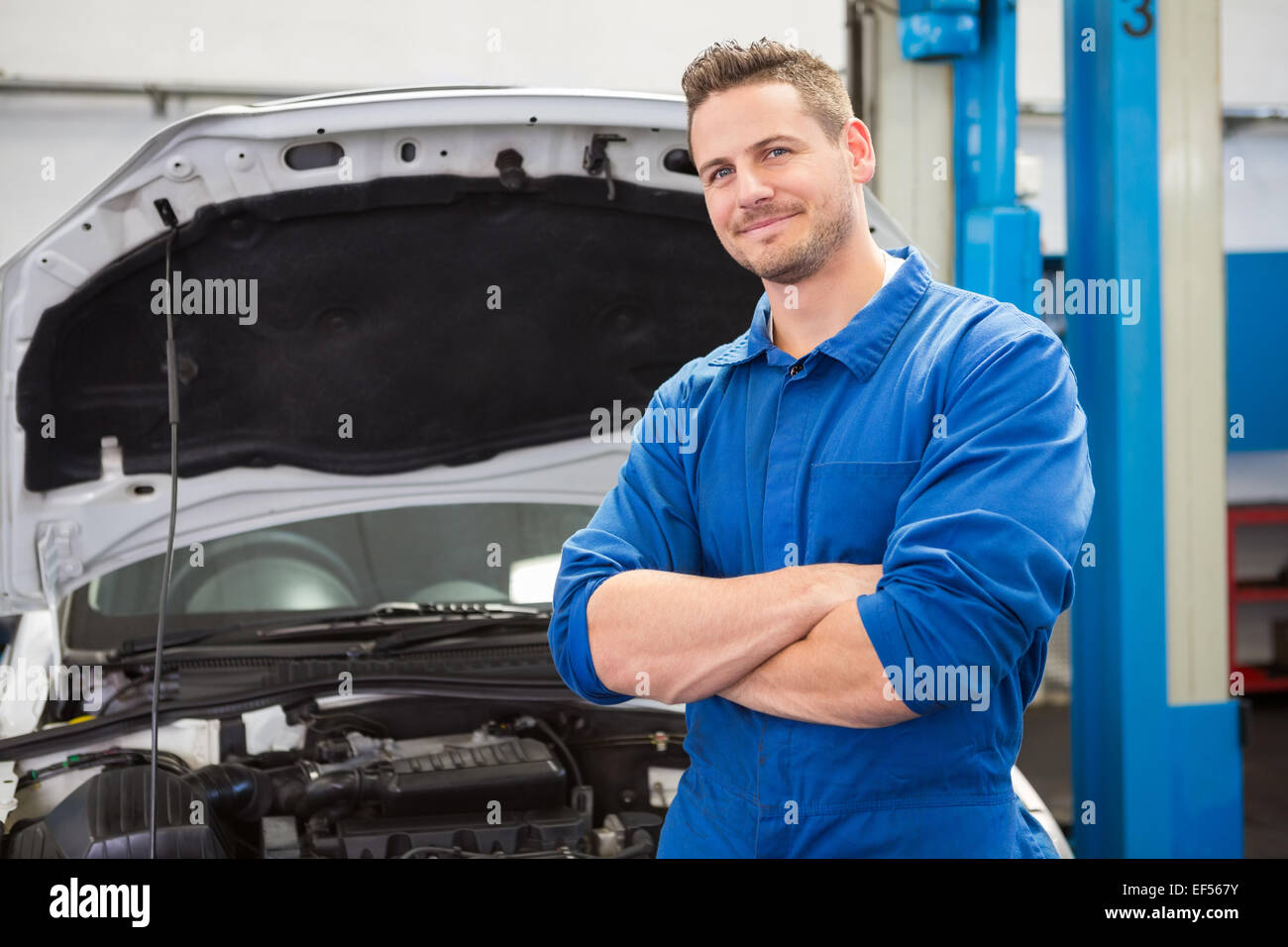 Satisfied customer standing with mechanic hi-res stock photography and ...