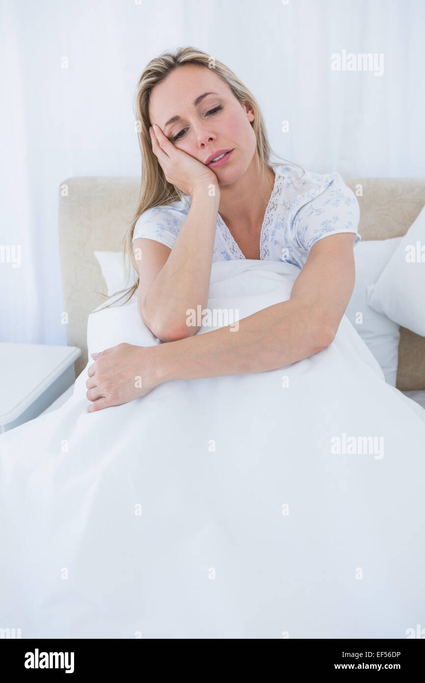 Tired blonde woman on the morning Stock Photo - Alamy
