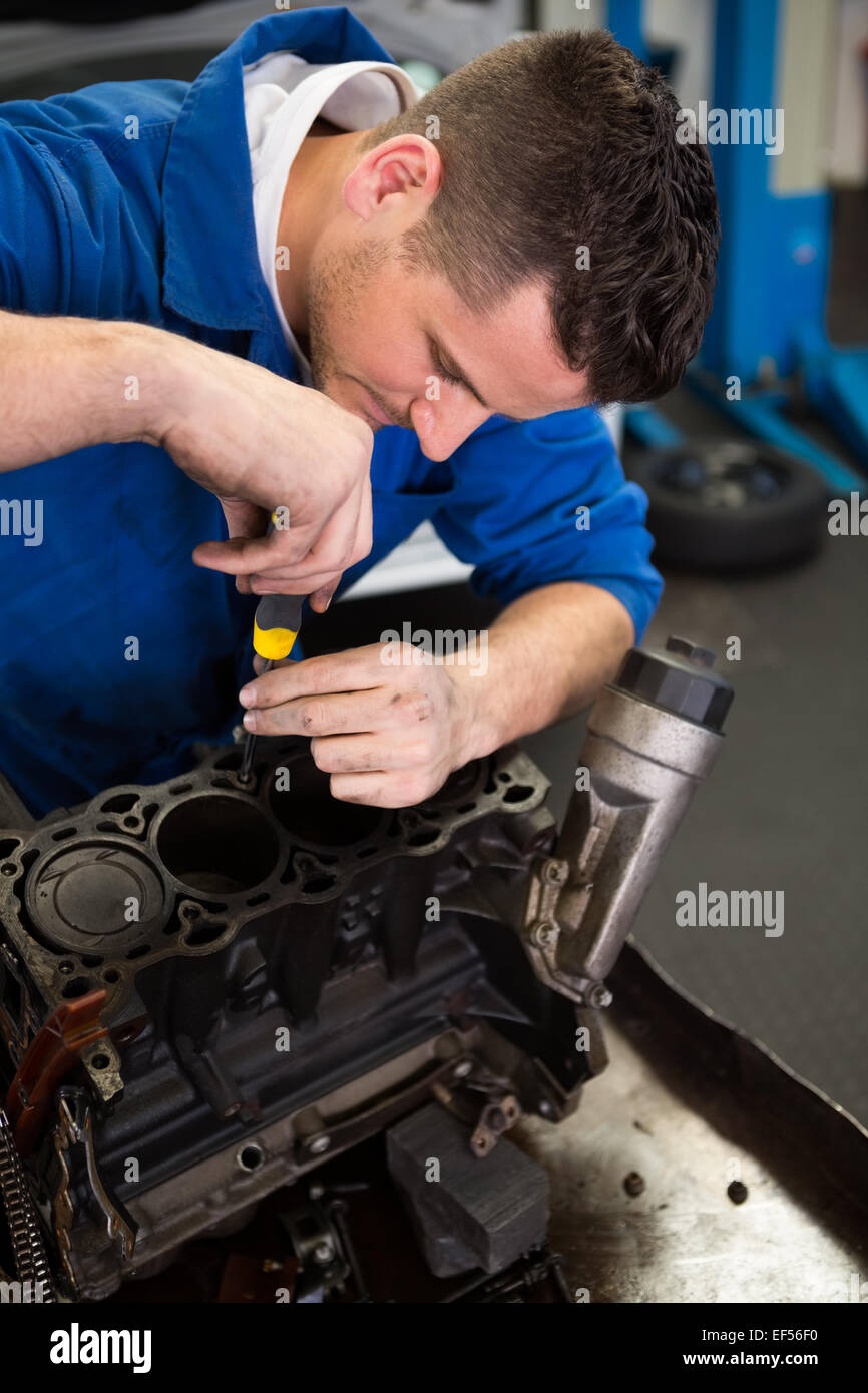 Mechanic working on an engine Stock Photo - Alamy