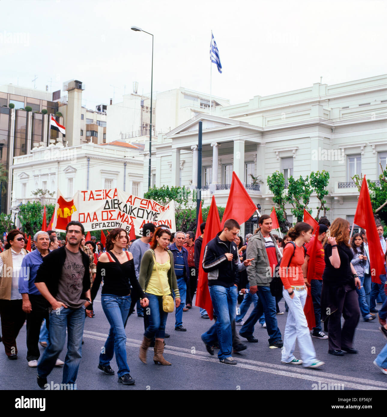 People march with banners at the 1st May Day demonstration in Athens ...