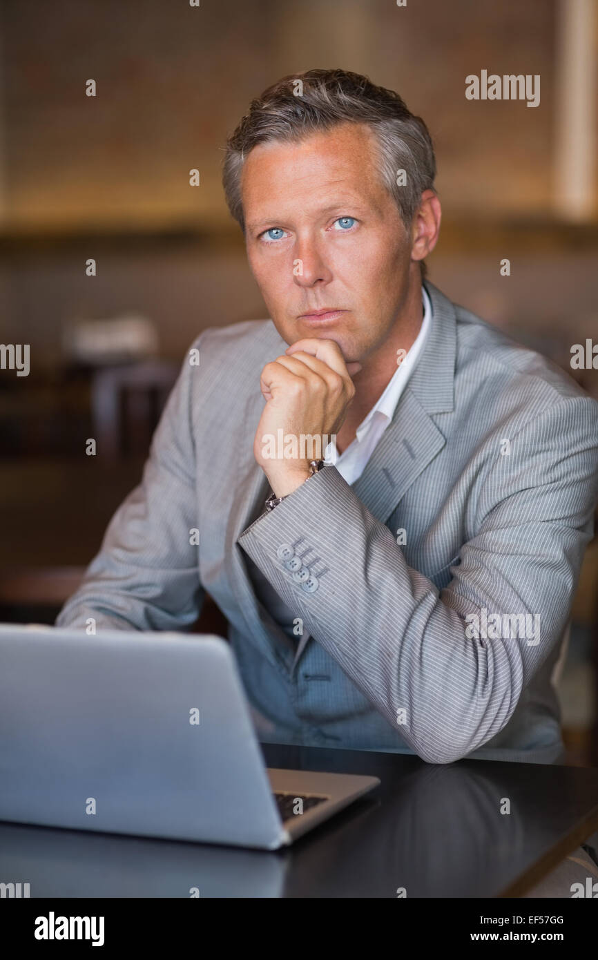 Serious businessman using his laptop Stock Photo - Alamy Serious businessman using his laptop Stock Photo - Alamy