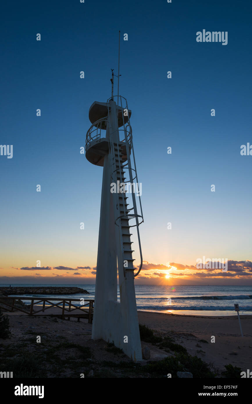 Lifeguard watchtower on a beach at sunrise Stock Photo - Alamy