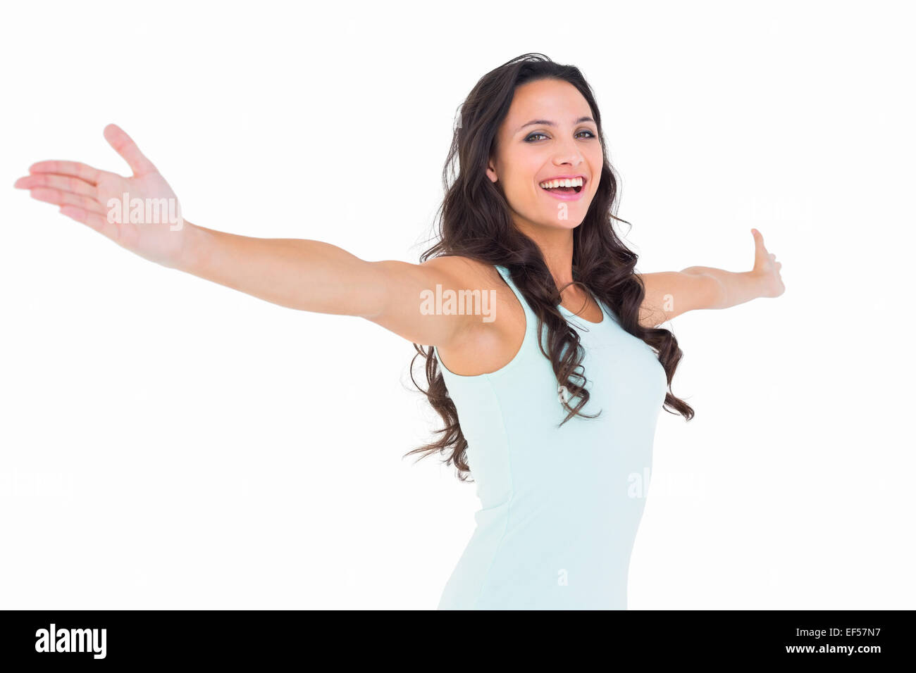 Carefree brunette with arms out Stock Photo - Alamy