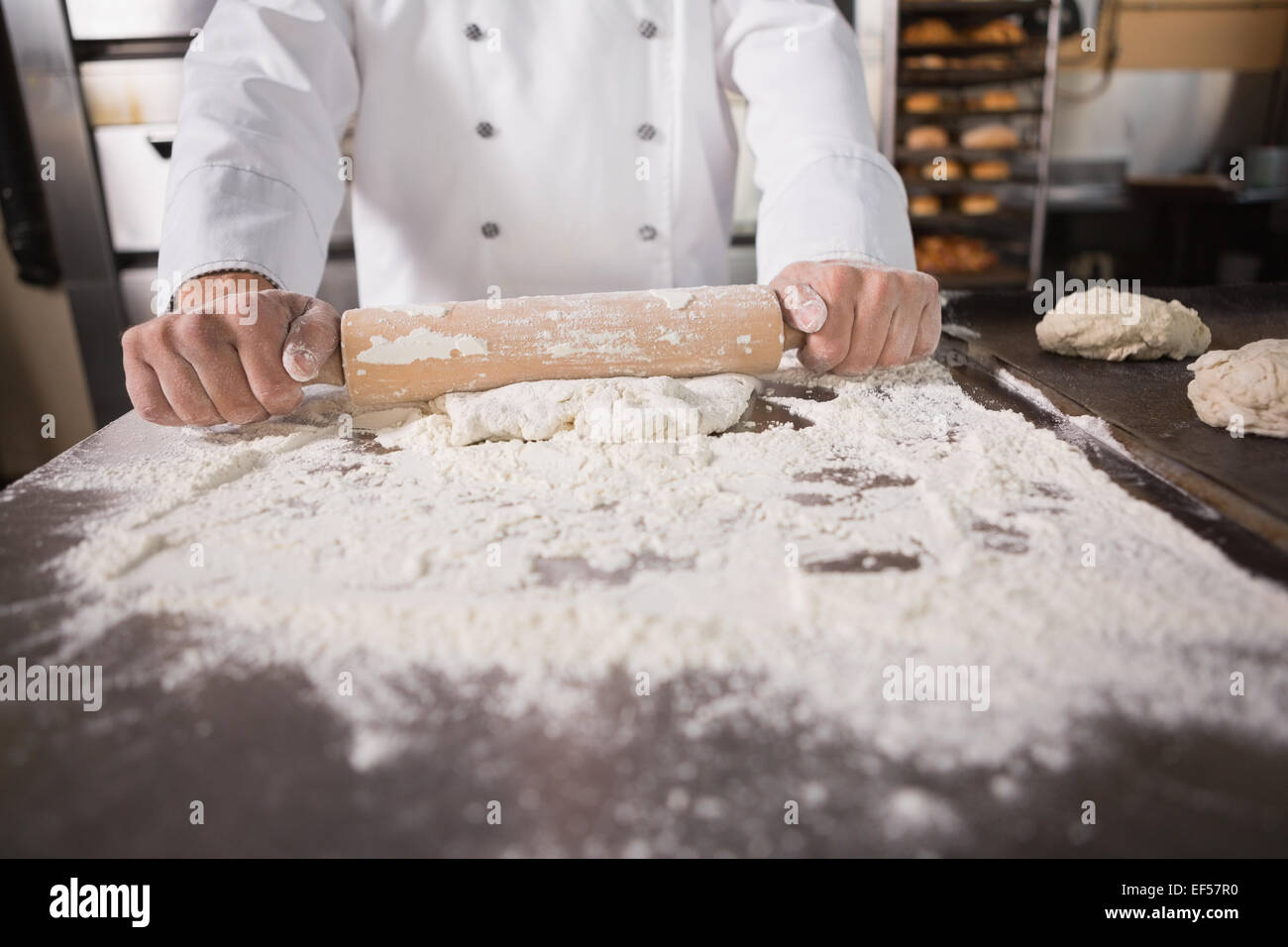 Close up of baker using a rolling pin Stock Photo - Alamy