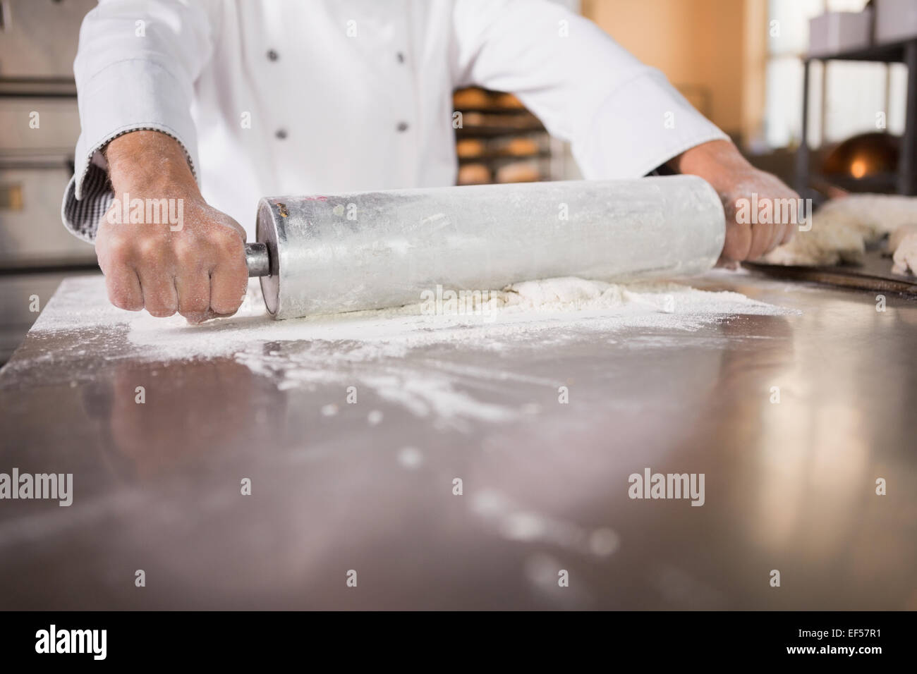 Close up of baker using a rolling pin Stock Photo - Alamy