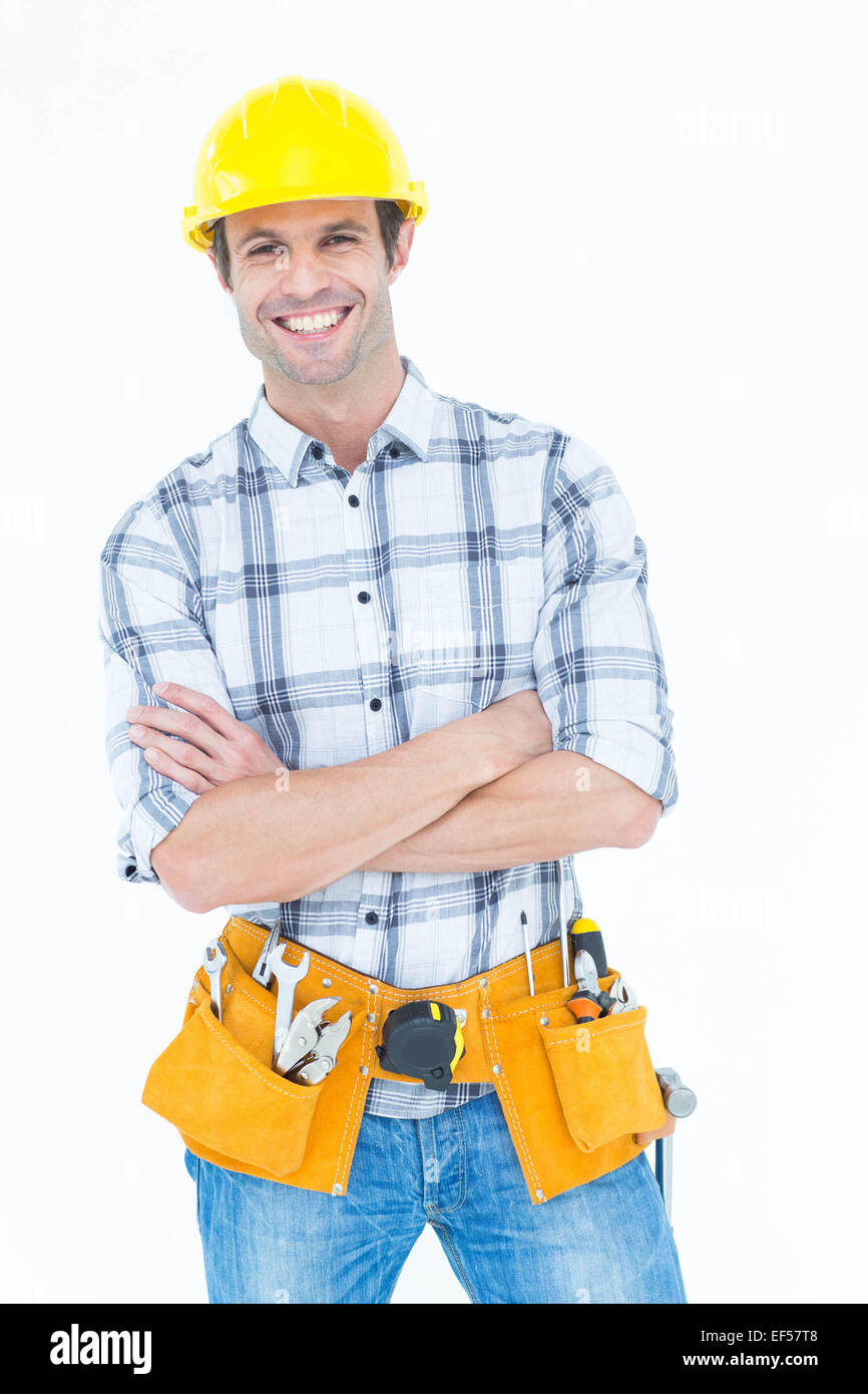 Technician standing arms crossed over white background Stock Photo - Alamy
