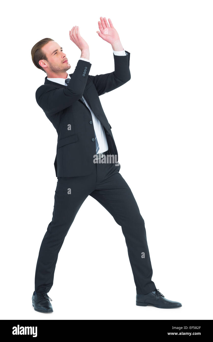 Handsome businessman with hands up Stock Photo - Alamy