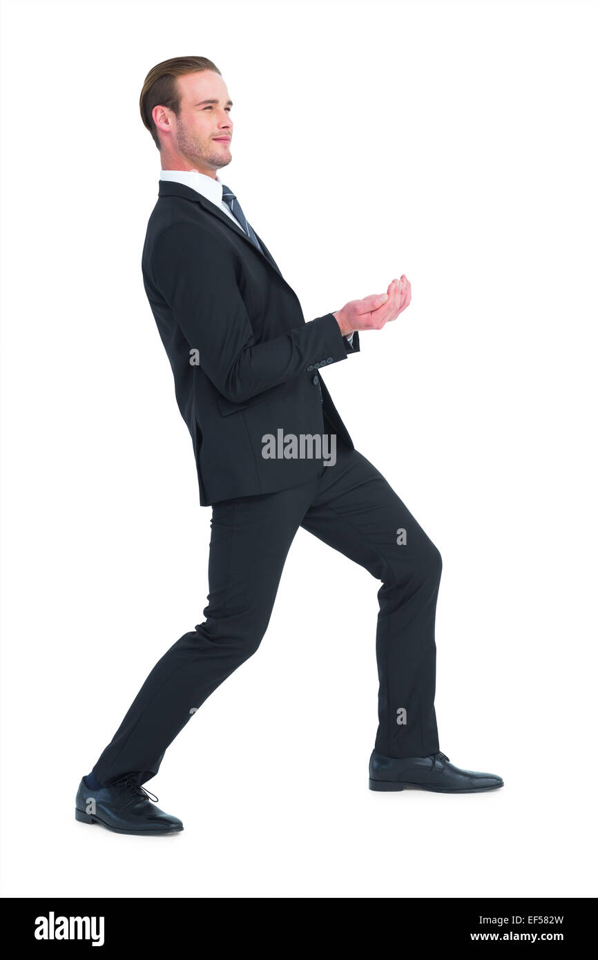Businessman smiling with hands out Stock Photo - Alamy