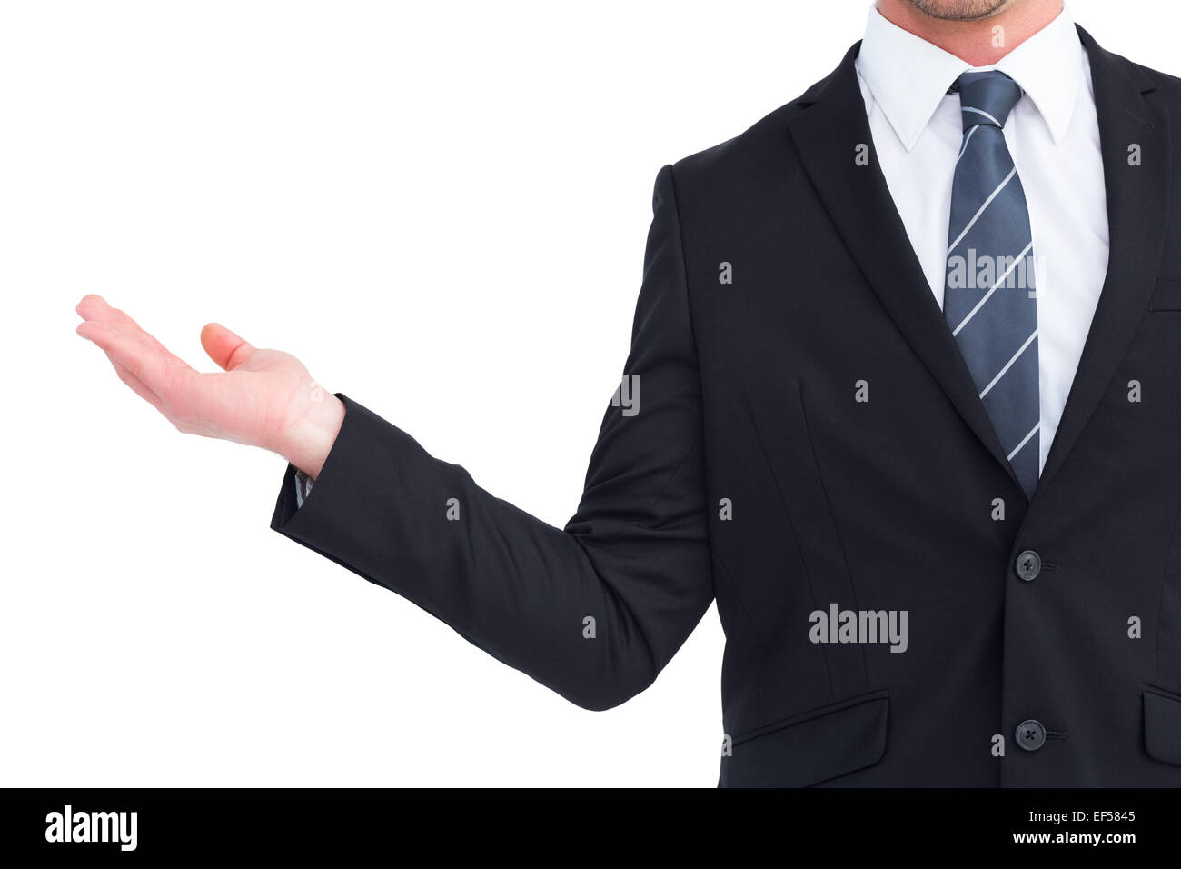 Businessman holding his hand out Stock Photo - Alamy