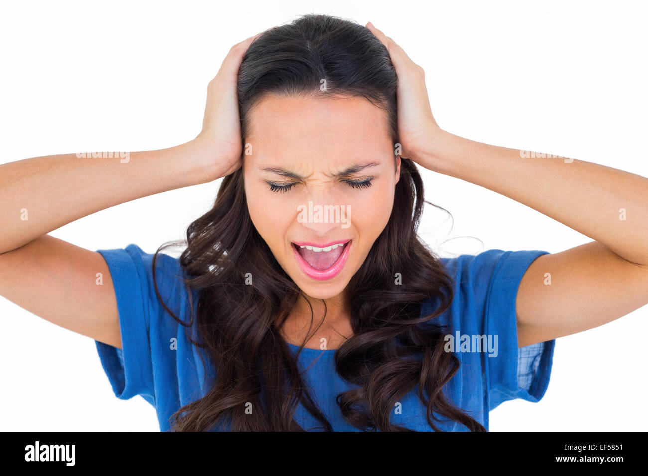 Angry brunette shouting at camera Stock Photo - Alamy