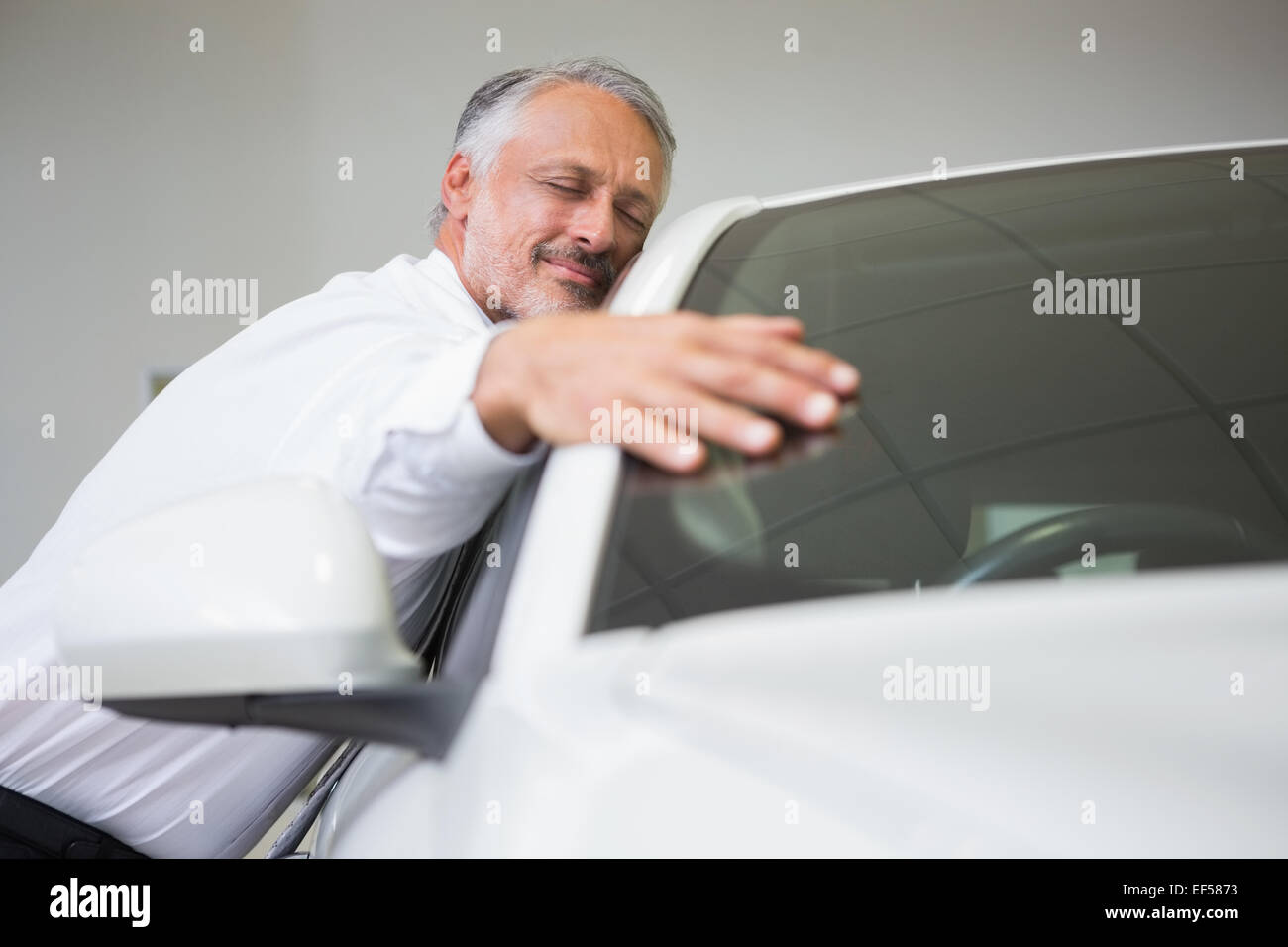 Man hugging on a car Stock Photo - Alamy