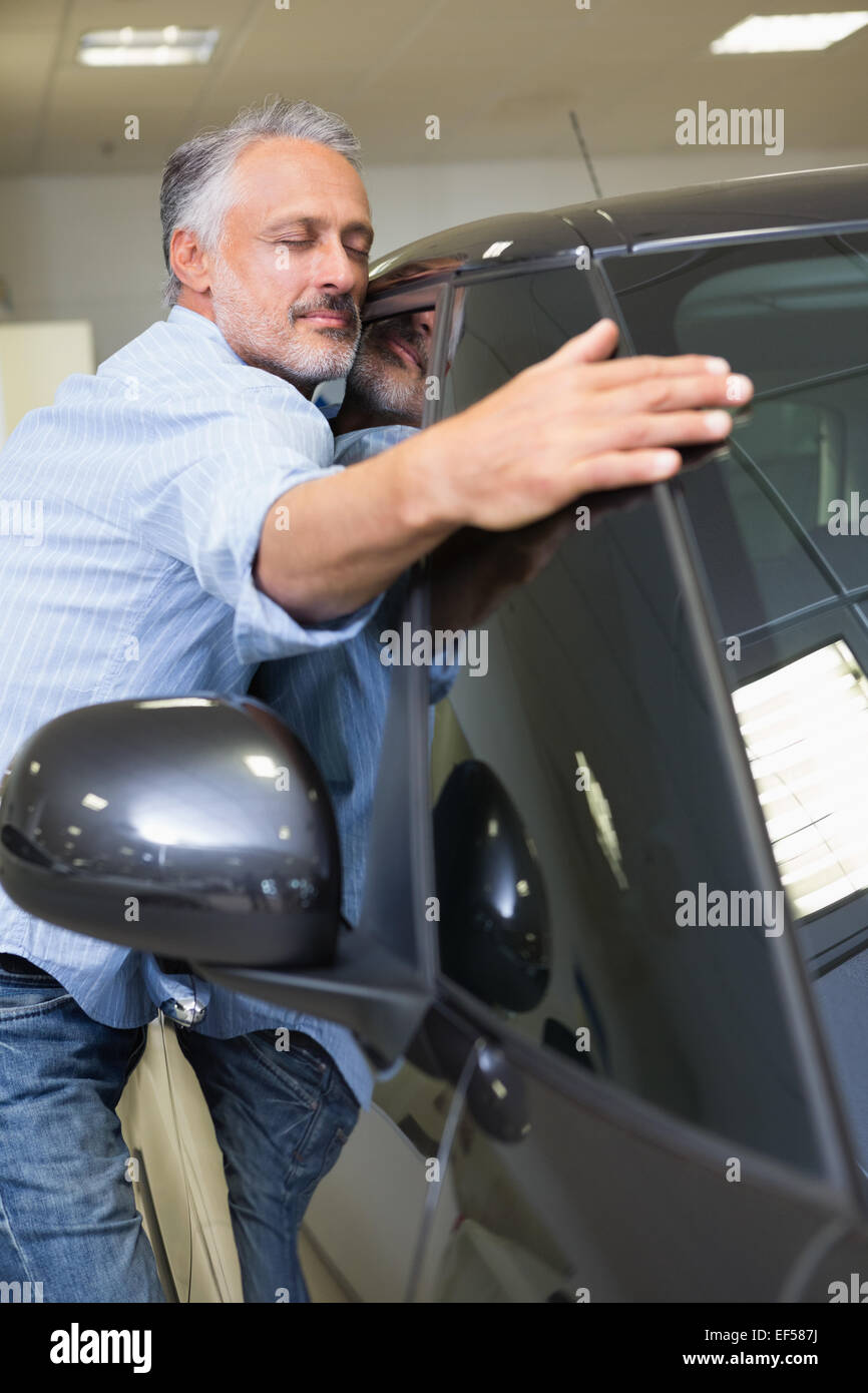 Man hugging on a car Stock Photo - Alamy