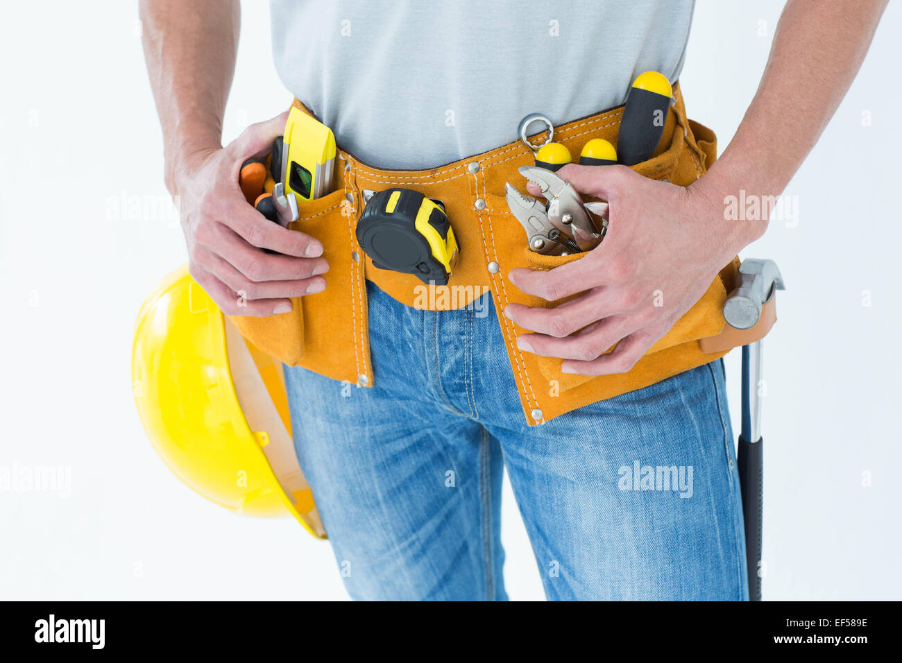 Technician with tool belt around waist Stock Photo - Alamy
