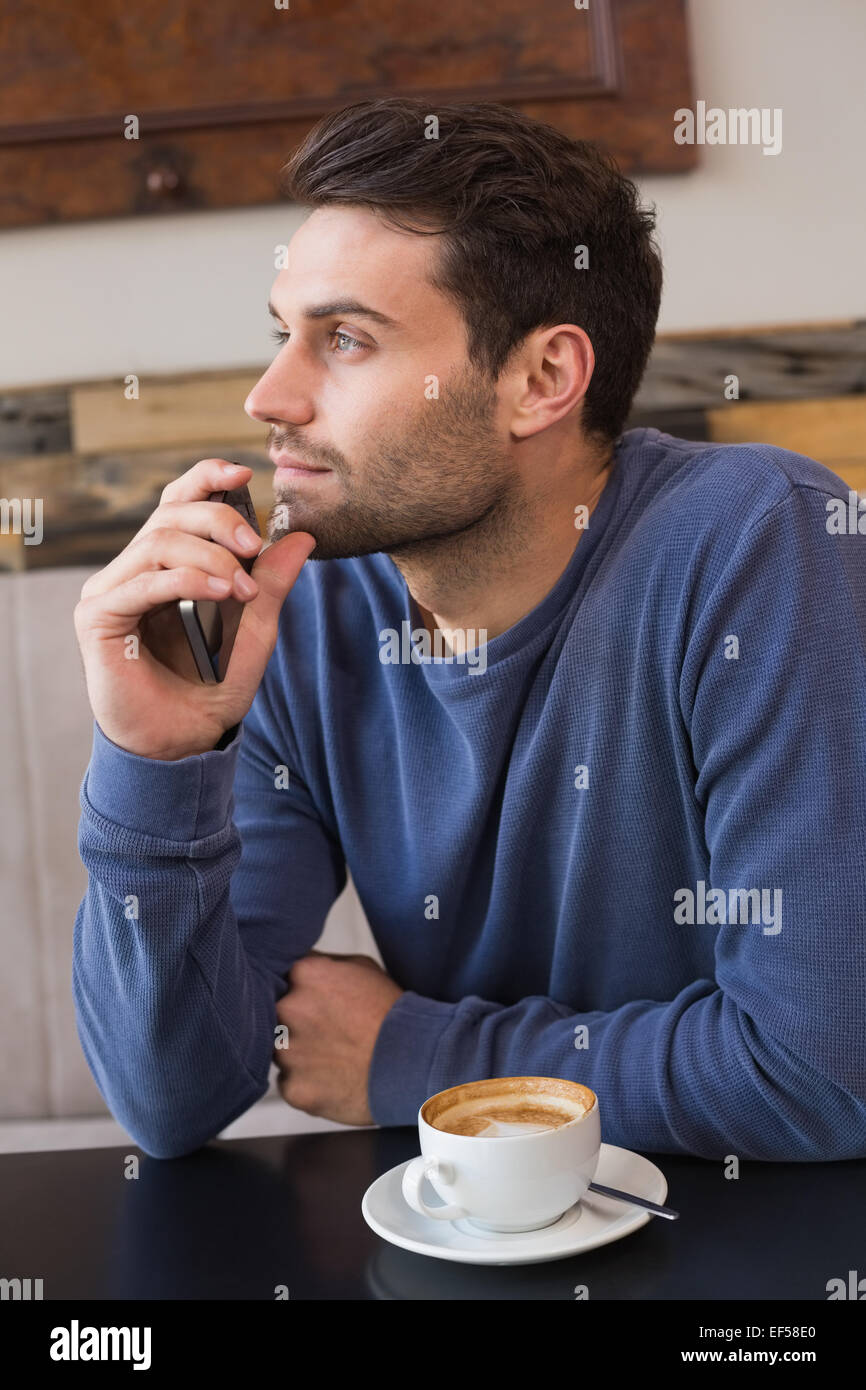 Young man using his smartphone Stock Photo - Alamy