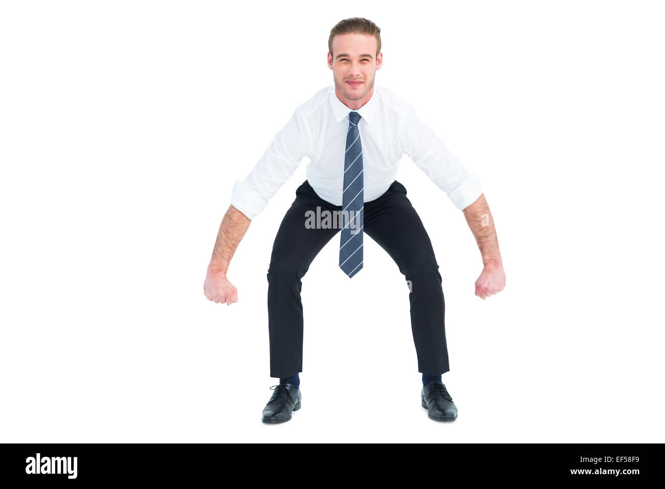 Businessman bending and lifting Stock Photo - Alamy