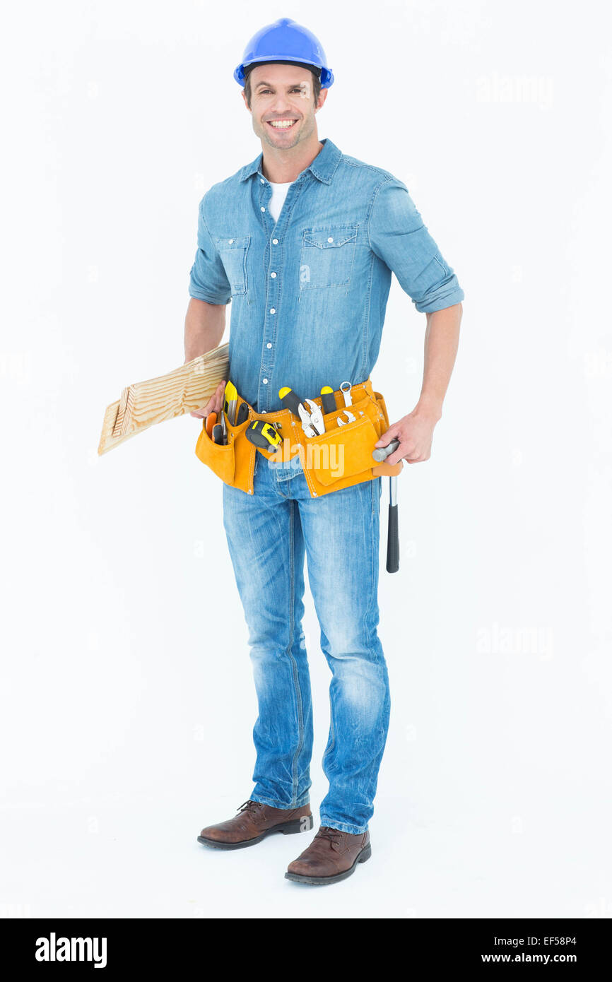 Happy carpenter with wooden planks Stock Photo - Alamy
