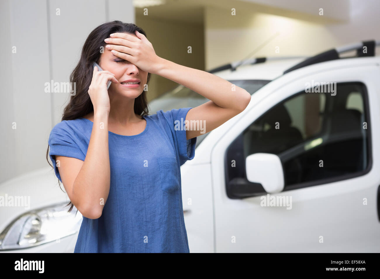 Young woman on phone crying hi-res stock photography and images - Alamy