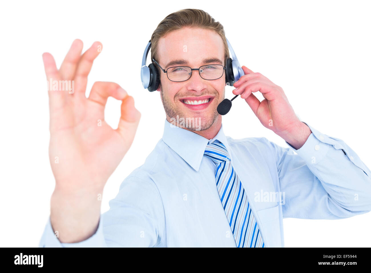 Businessman with headset making okay sign Stock Photo - Alamy