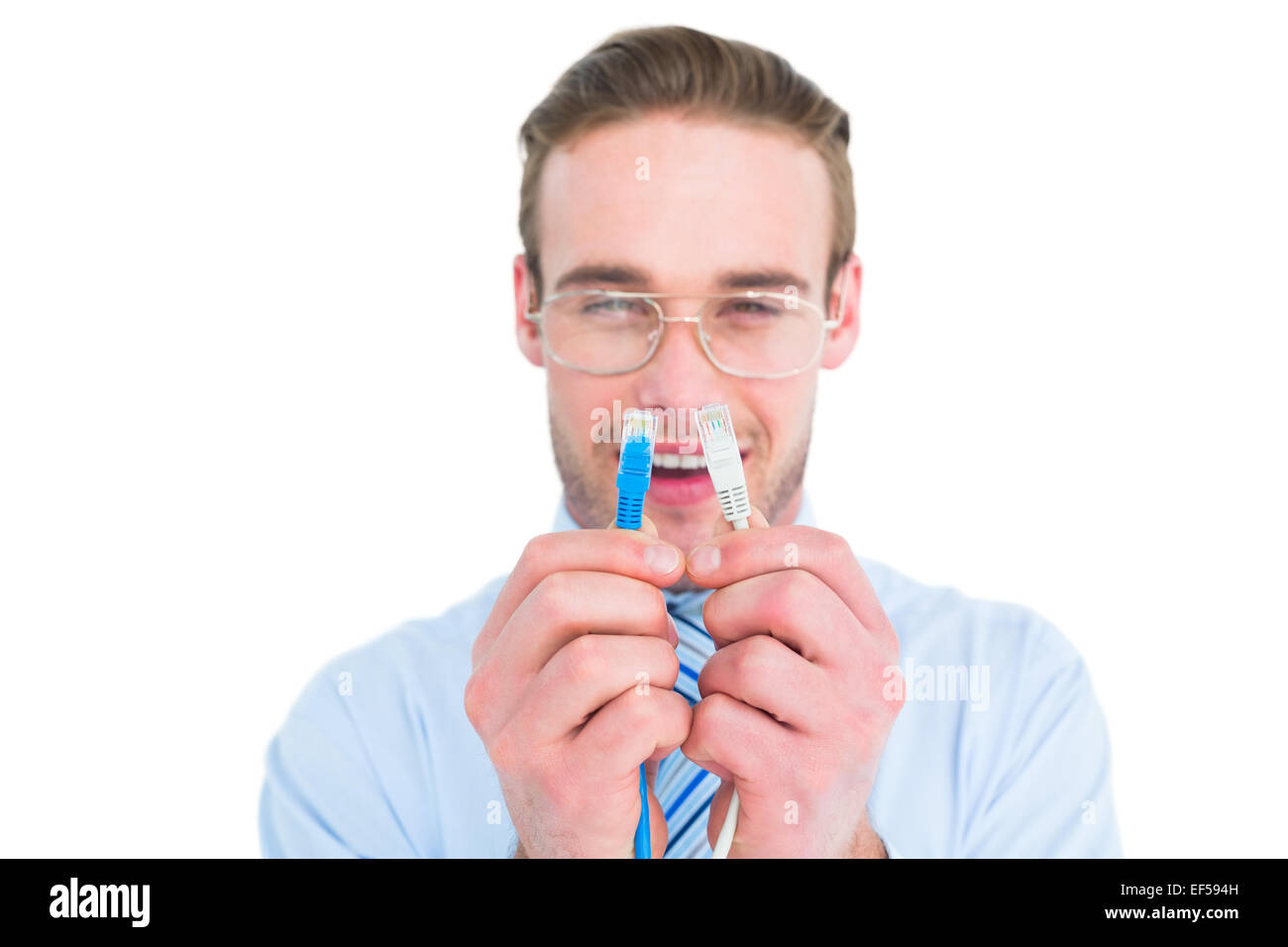 Geeky businessman holding two cables Stock Photo - Alamy