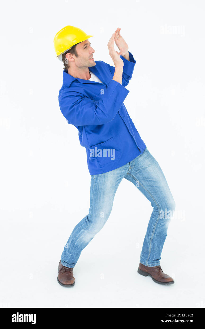 Architect pushing over white background Stock Photo - Alamy