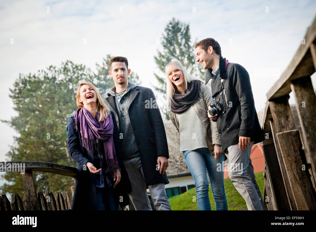 Group of friends walking outdoors Stock Photo - Alamy