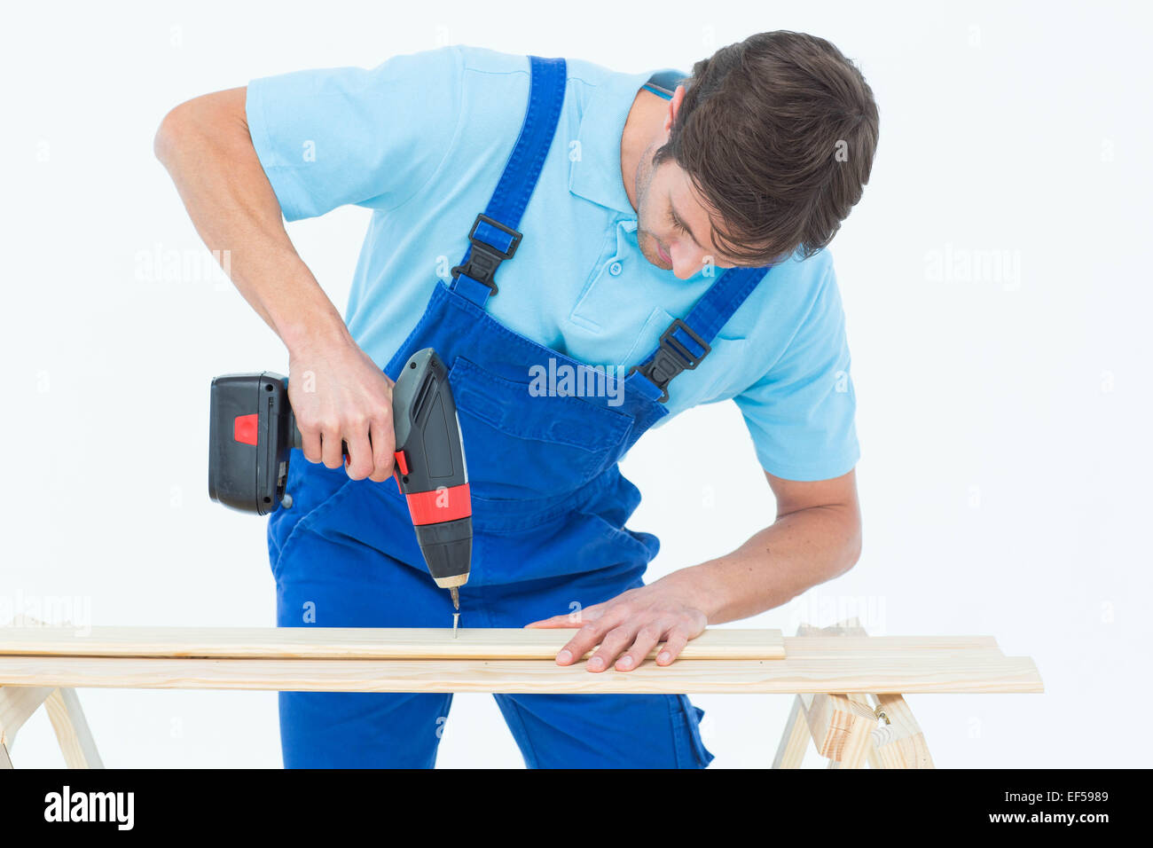 Carpenter using drill machine on wood Stock Photo - Alamy