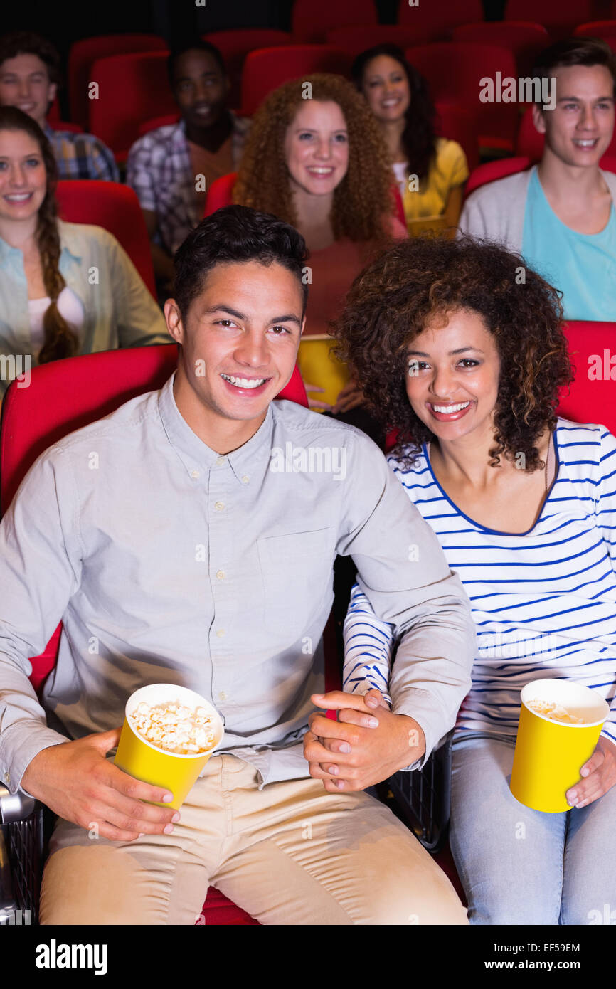 Young couple watching a film Stock Photo - Alamy