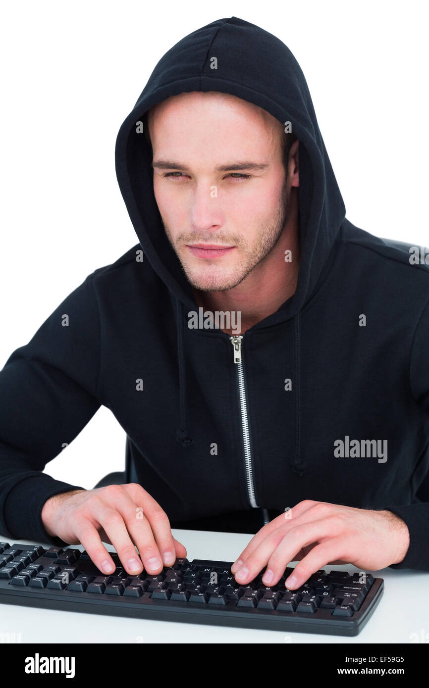 Concentrated hacker typing on keyboard Stock Photo - Alamy