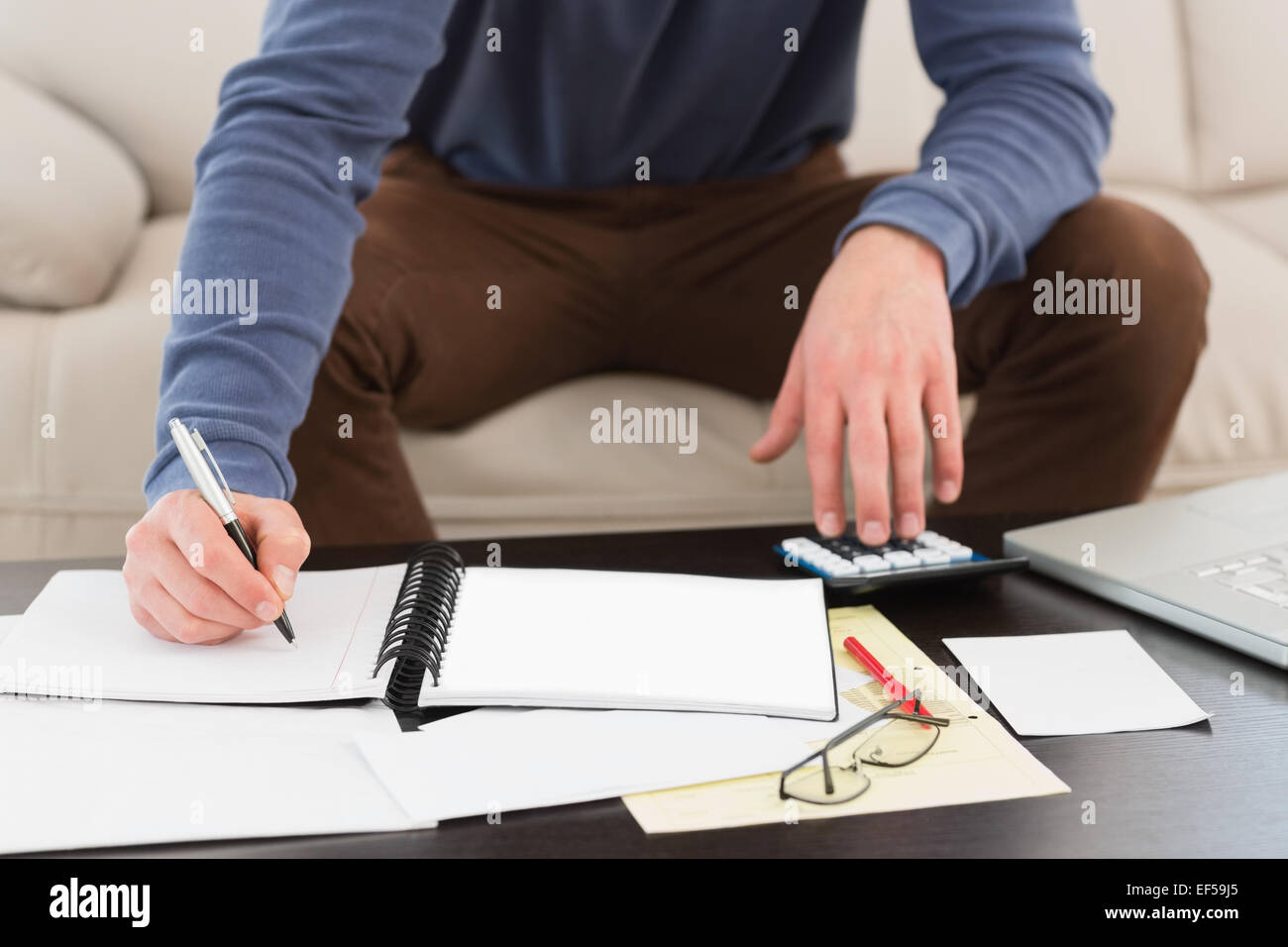 Man using calculator notes hi-res stock photography and images - Alamy