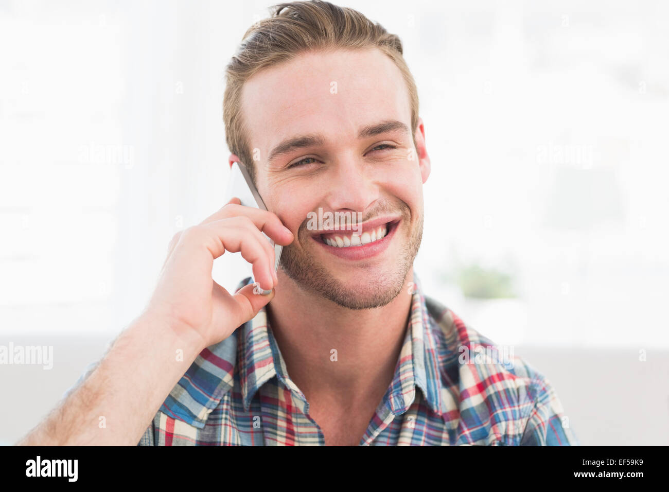 Portrait of smiling man on the phone Stock Photo - Alamy
