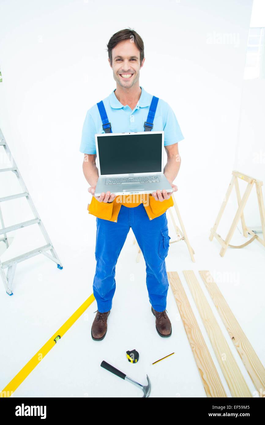 Repairman holding laptop computer hi-res stock photography and images ...