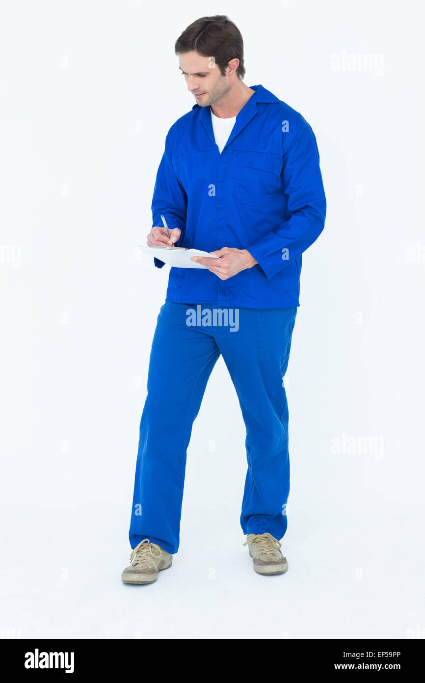 Mechanic writing notes over white background Stock Photo - Alamy