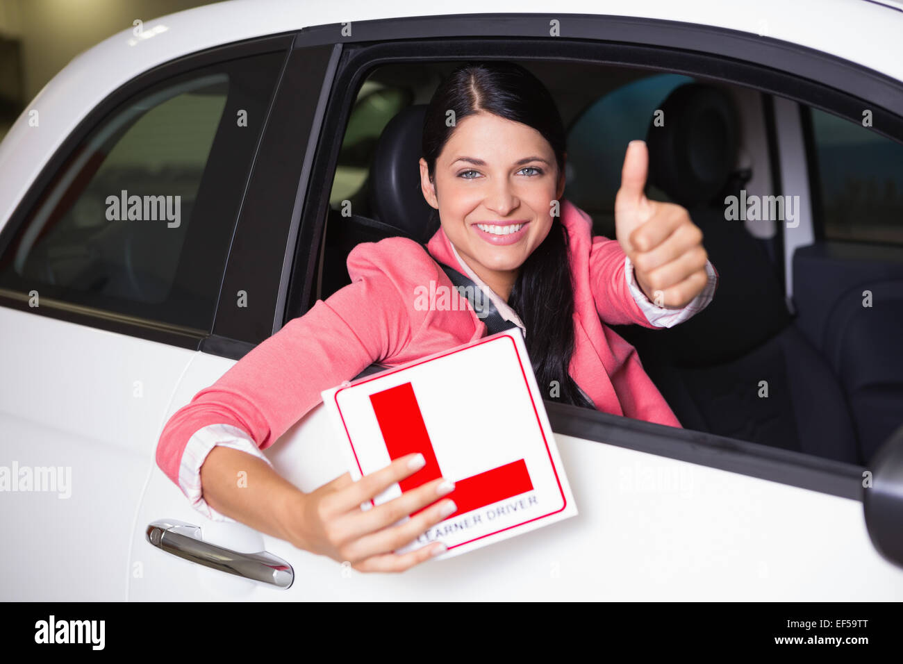 Woman smiling holding learner hi-res stock photography and images - Alamy