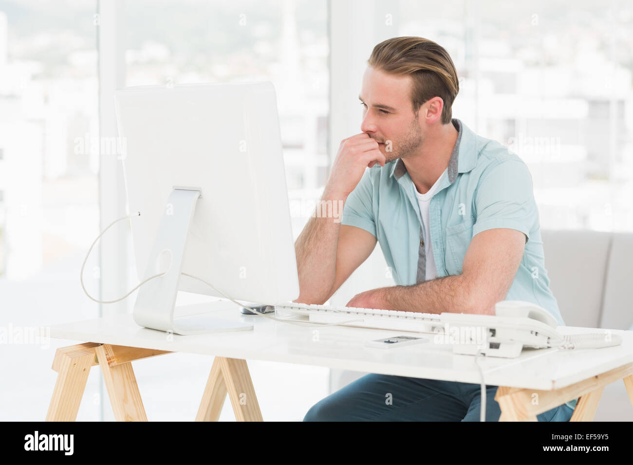 Concentrated businessman working with computer Stock Photo - Alamy