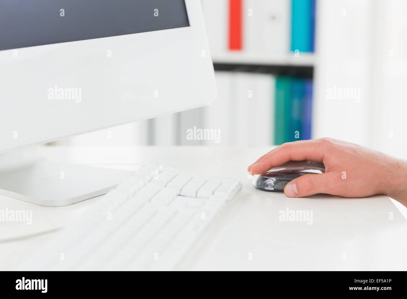 Hand of businessman using mouse of computer Stock Photo - Alamy