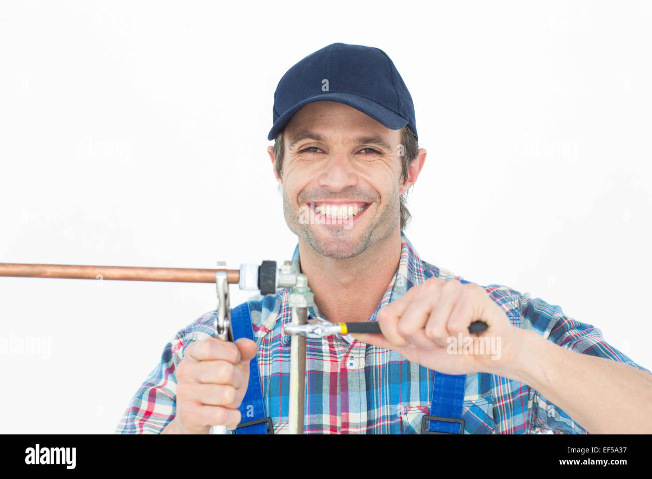 Portrait happy man holding pipe hi-res stock photography and images - Alamy