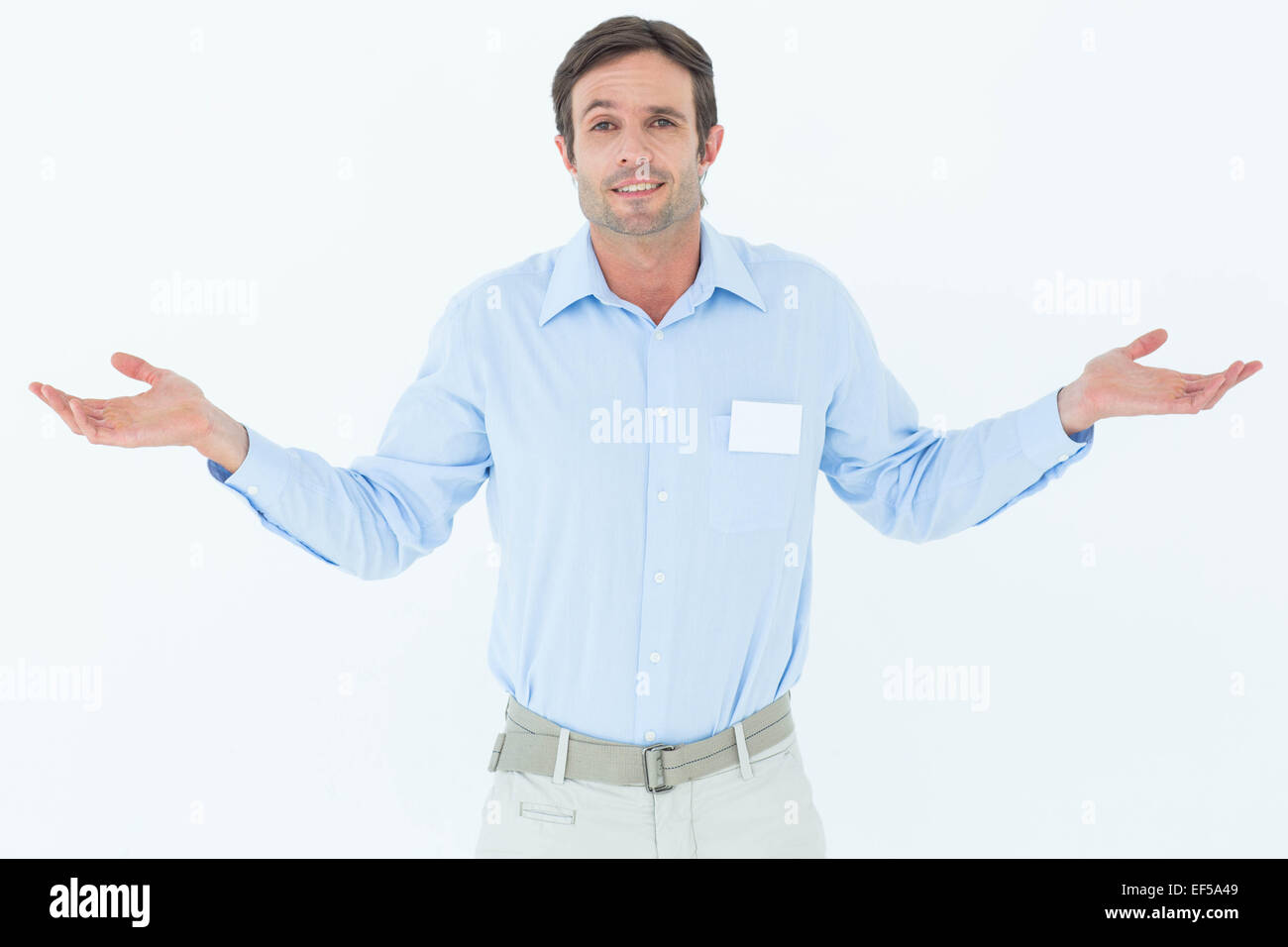 Businessman shrugging shoulders over white background Stock Photo - Alamy