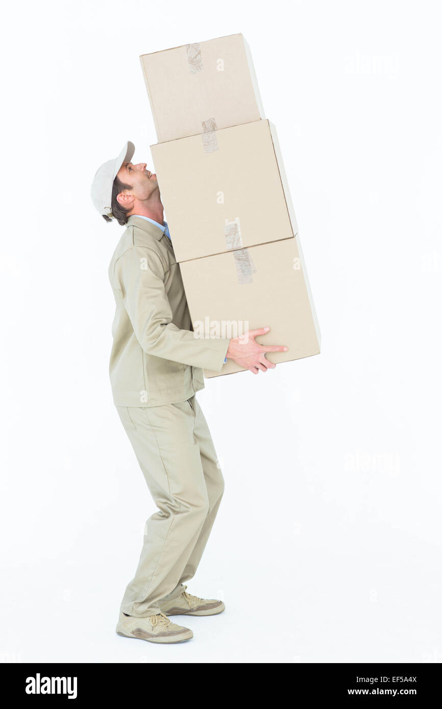 Delivery man carrying boxes Stock Photo - Alamy