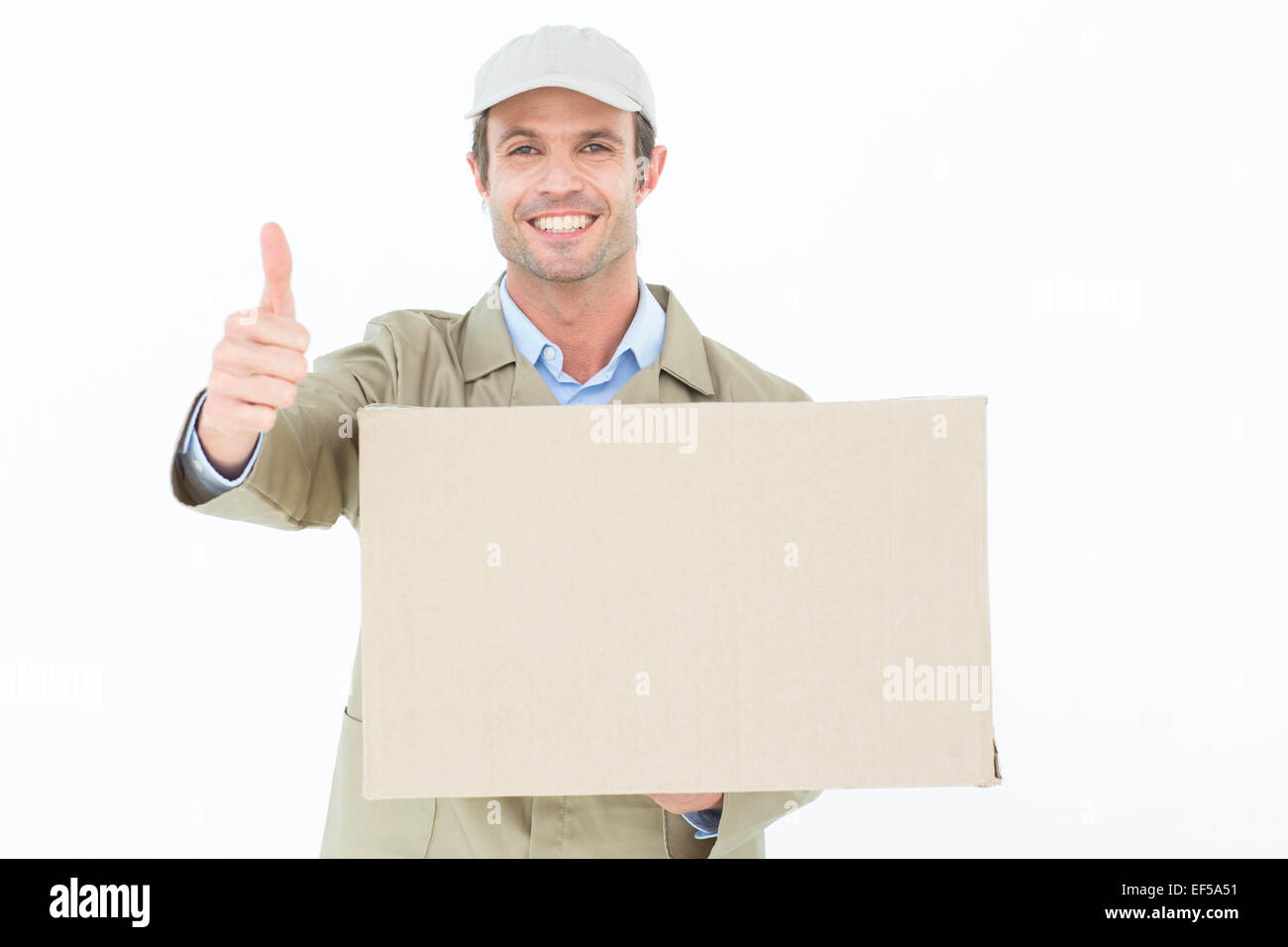 Happy delivery man gesturing thumbs up while carrying cardboard box ...