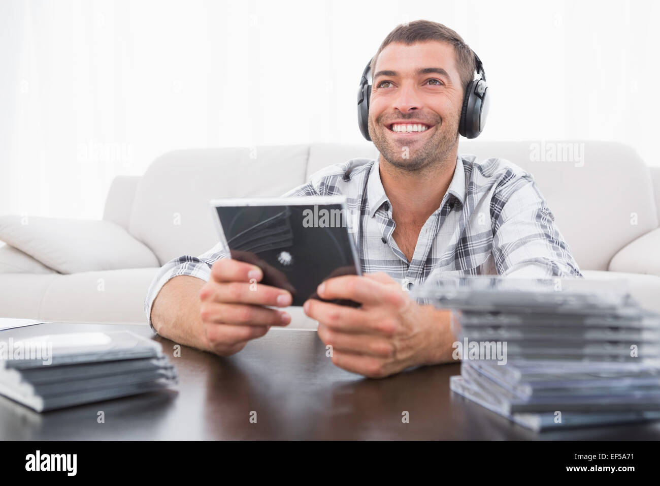 A man listening to cds Stock Photo - Alamy