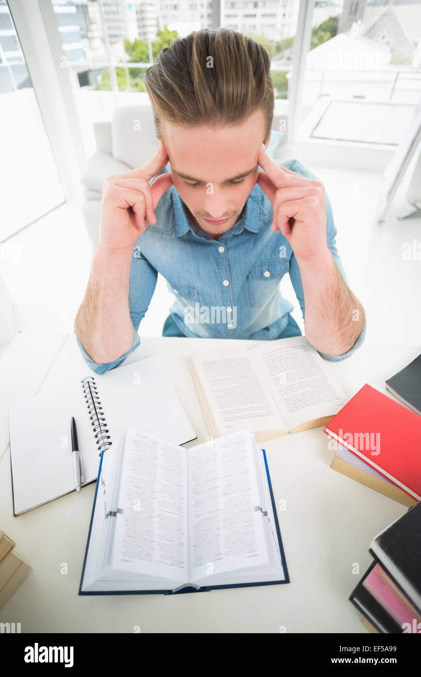 Focused businessman studying at his desk Stock Photo - Alamy