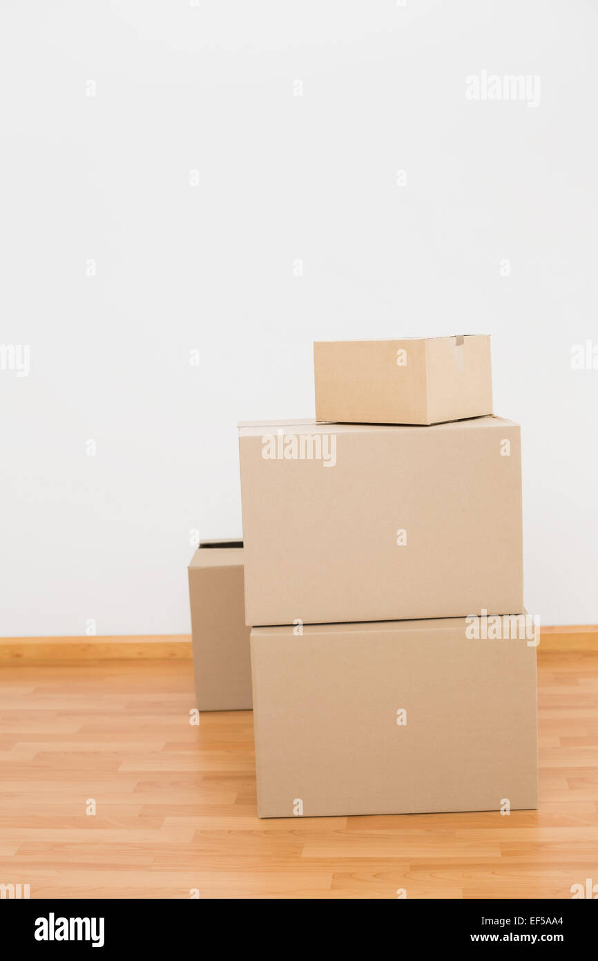 Pile of cardboard boxes on the floor Stock Photo - Alamy