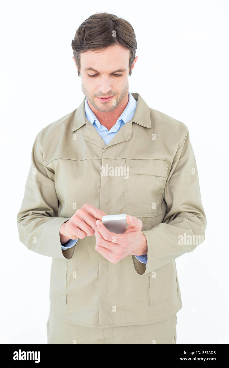 Delivery man using smart phone Stock Photo - Alamy